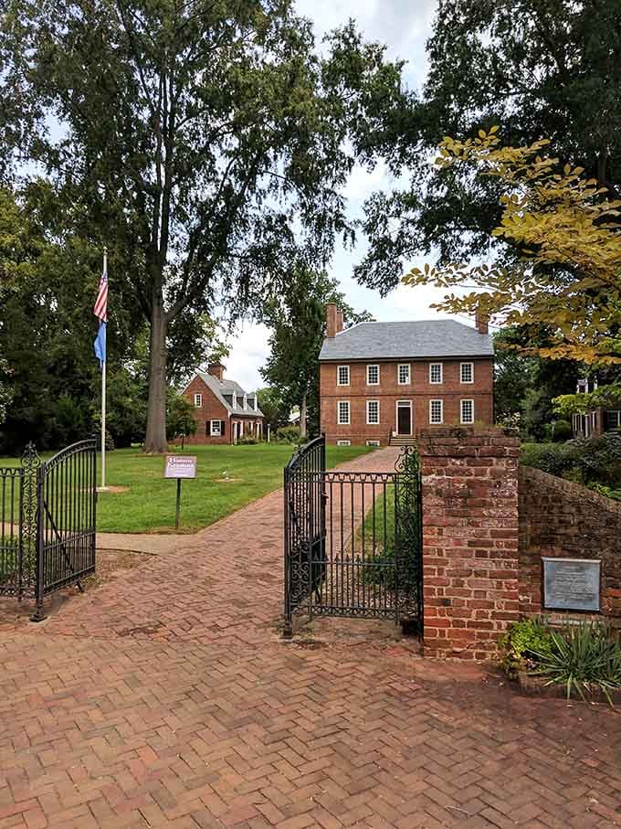 Iron gates, brick pathways, and a stately Georgian mansion beyond — Kenmore Plantation carries centuries of Virginia history without breaking a sweat.