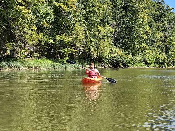 Paddling the Sugar Creek in a bright orange kayak, grinning like you just discovered the world's best secret.