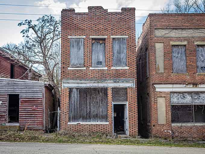 Castellated rooflines hint at architectural ambitions that outlasted the community's economic fortunes by several decades now.