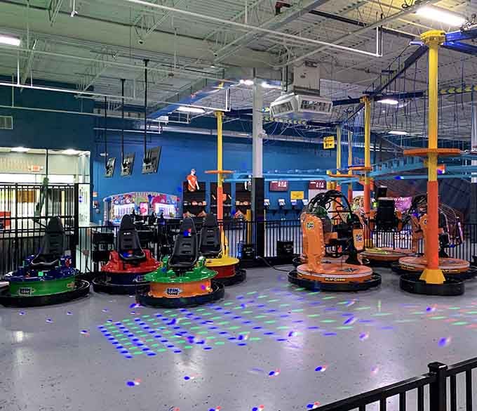 Colorful bumper cars spinning under disco lights, the Spin Zone is basically a dance party you can crash into.