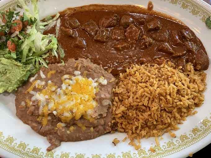 Chile Colorado with rice and beans: the kind of plate that makes you forget whatever was bothering you today.