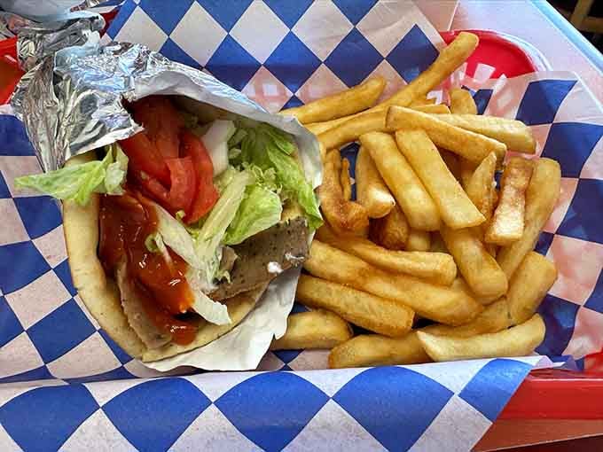 A gyro wrapped in foil beside golden fries. Simple, honest, and exactly what lunch was meant to be.