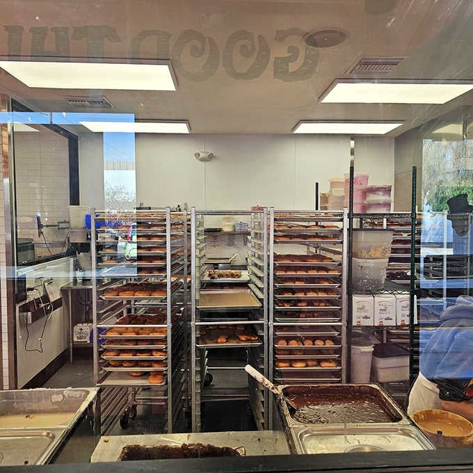 Behind the glass, rolling racks of fresh donuts prove this charming bakery means serious business.