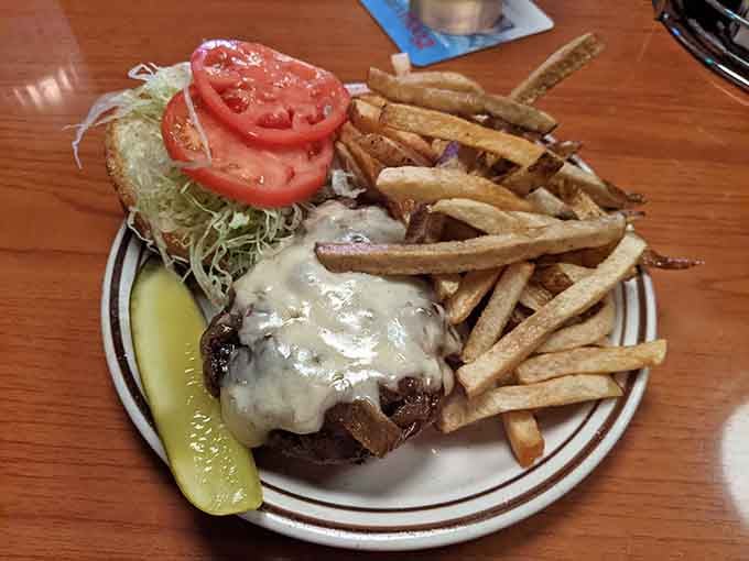 Double the meat, double the cheese, a pickle on the side, and enough fries to make you seriously reconsider your afternoon plans.