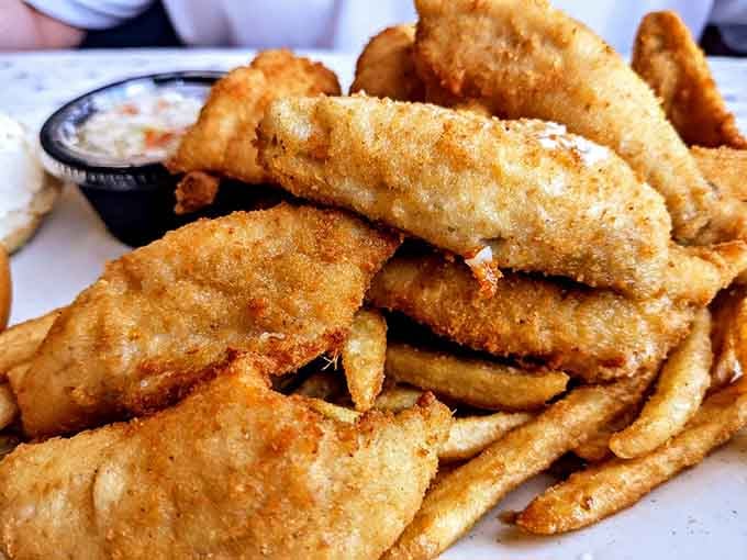 That mountain of hand-breaded perch isn't showing off. It's just being honest about how good it is.