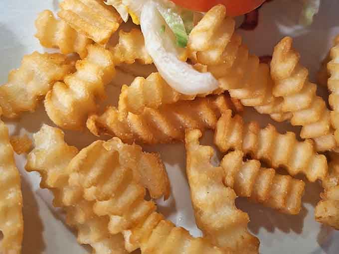 Those waffle fries aren't just a side dish, they're the supporting cast that deserves its own standing ovation.