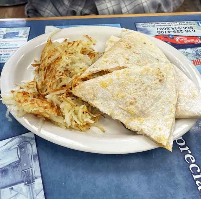Golden hash browns and a perfectly folded quesadilla, proof that breakfast doesn't always follow the rules.