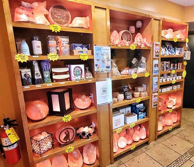 Salt lamps, scrubs, and wellness goodies line the shelves, because apparently you can take the calm home with you.