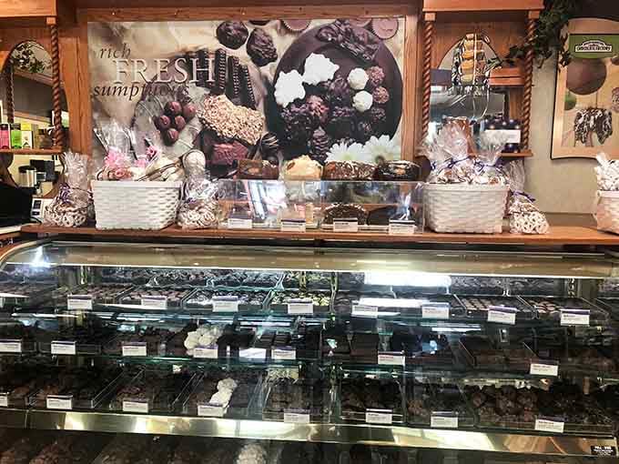 A glass case full of chocolates that will absolutely derail your shopping budget in the most delicious way possible.