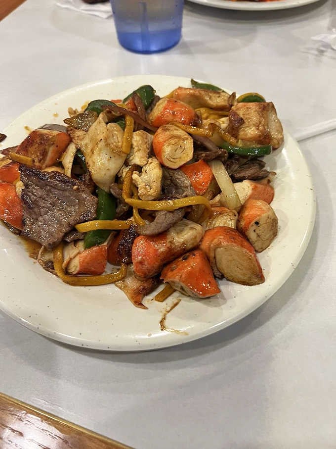 Hibachi-style beef, chicken, and vegetables cooked with serious intention. This plate means business, and it delivers.