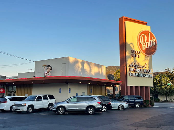 The Big Boy mascot standing on that rooftop at golden hour looks like he's auditioning for his own action movie sequel.
