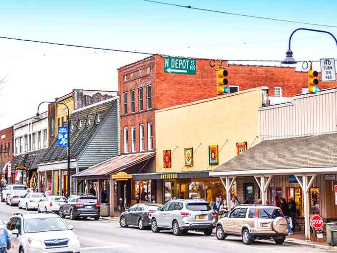 Mountain backdrop meets colorful storefronts in a combination that makes you want to park and explore everything.