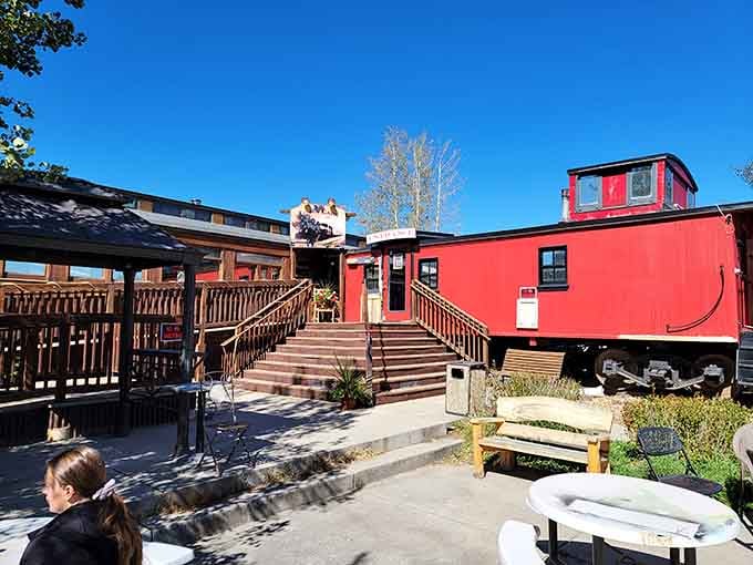Bright red cabooses and vintage train cars create an unexpected dining experience that's pure mountain town charm and whimsy.