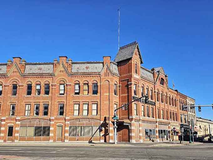 Cortland's grand Victorian corner building stands tall against a brilliant blue sky, practically daring you not to fall in love.
