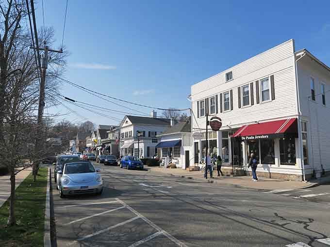White clapboard storefronts and a jeweler's red awning give Essex village a quiet, unhurried dignity that feels genuinely timeless.