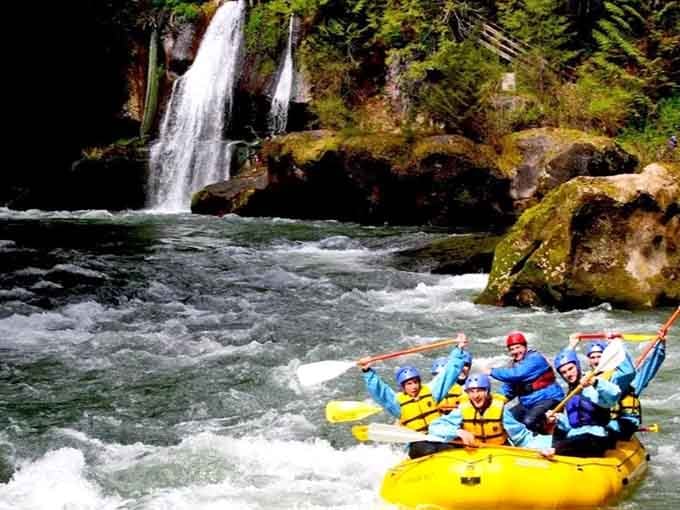 A waterfall backdrop turns your Green River float into something straight out of an adventure movie's opening scene.