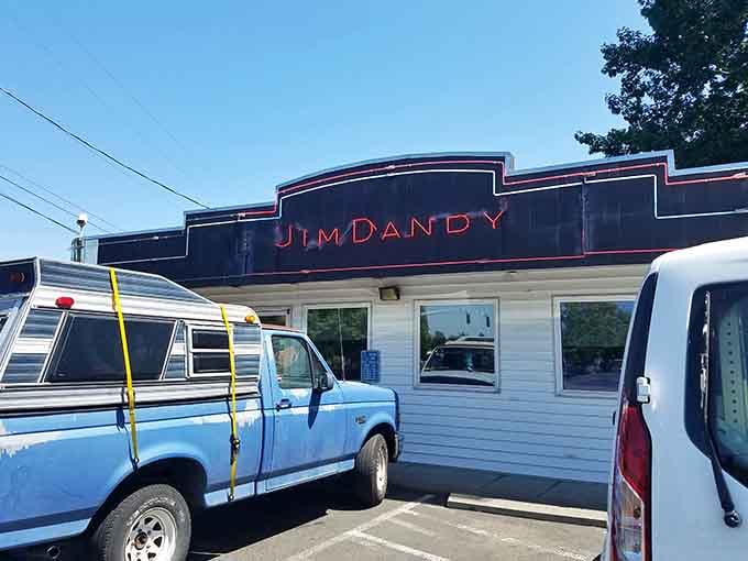 A vintage blue pickup parked out front feels less like coincidence and more like perfect set dressing.