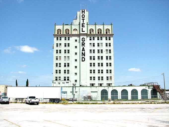 The Hotel Grand rises over Lake Wales like a faded postcard from a more glamorous era, still magnificent up close.