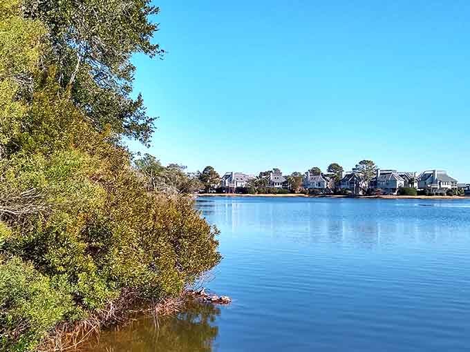 Mirror-calm waters reflect endless blue skies in this tranquil inlet where time moves at low-tide speed.