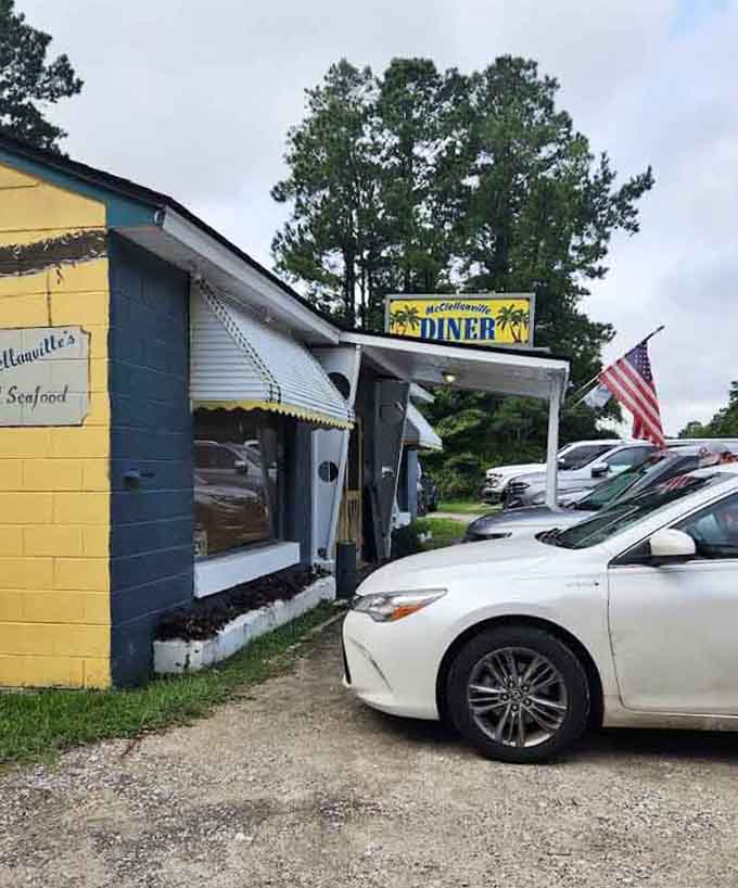 That cheerful yellow exterior and tropical diner sign along US-17 practically shout "fresh seafood ahead, don't you dare drive past."
