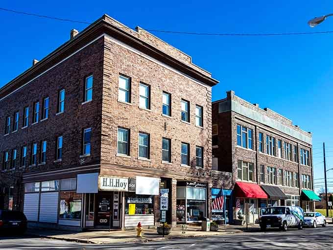 New Castle's warm brick corner buildings and cheerful red awning give downtown the welcoming energy of a good neighbor.