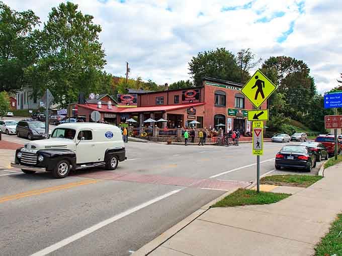 Classic trucks and outdoor dining tables signal adventure ahead, where the river calls and good times are waiting.