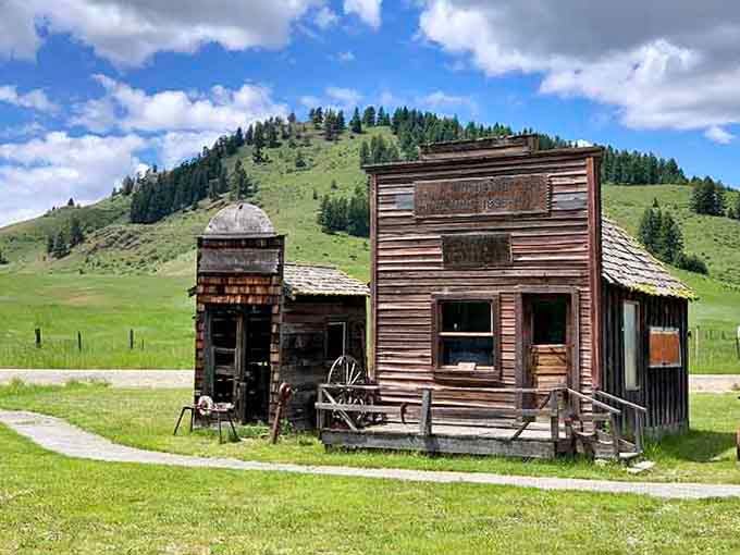 Weathered wooden storefronts stand against rolling green hills like characters from an old Western waiting for their closeup.