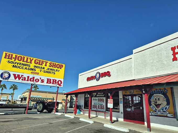 That bright yellow sign next to the red awning proves the best BBQ doesn't need fancy marketing gimmicks.