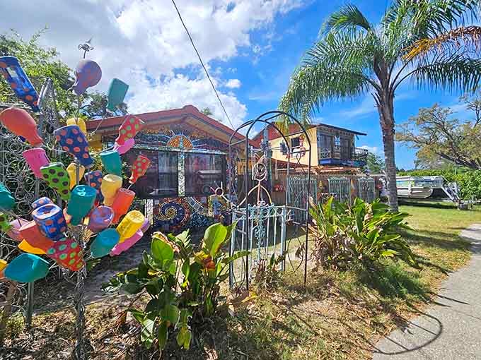 Painted bottles, mosaic swirls, and metal sculptures erupt from this Safety Harbor yard like creativity finally ran out of room indoors.