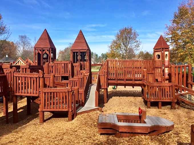Autumn colors frame this wooden fortress like a postcard, proving playgrounds look better when nature provides the backdrop.