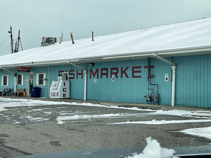 Even under a heavy winter sky, that teal building and its ice machine stand ready to serve the freshest catch around.