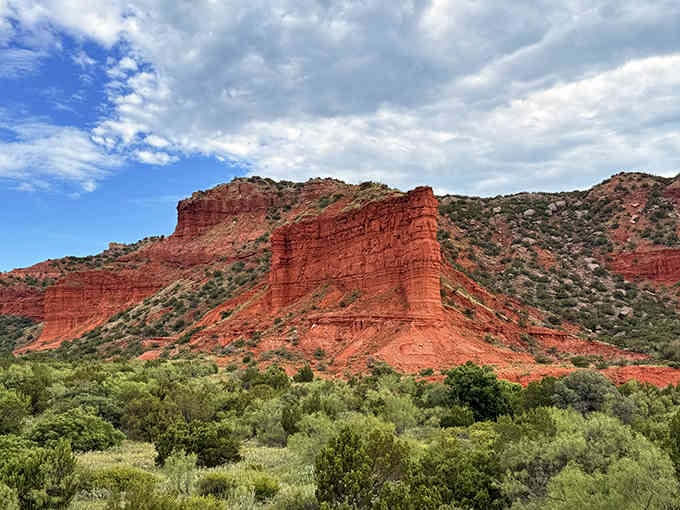 These dramatic red cliffs rise from the valley floor like nature's own cathedral reaching toward heaven.