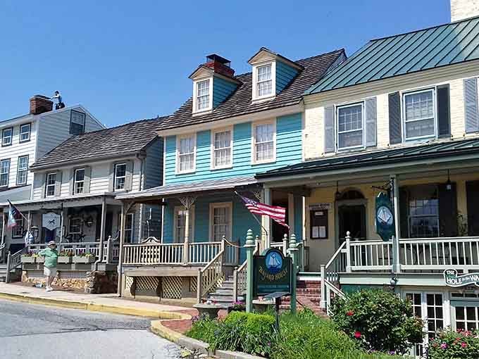 Colorful painted porches and cheerful storefronts line Chesapeake City's street like a postcard that somehow smells of fresh flowers and possibility.