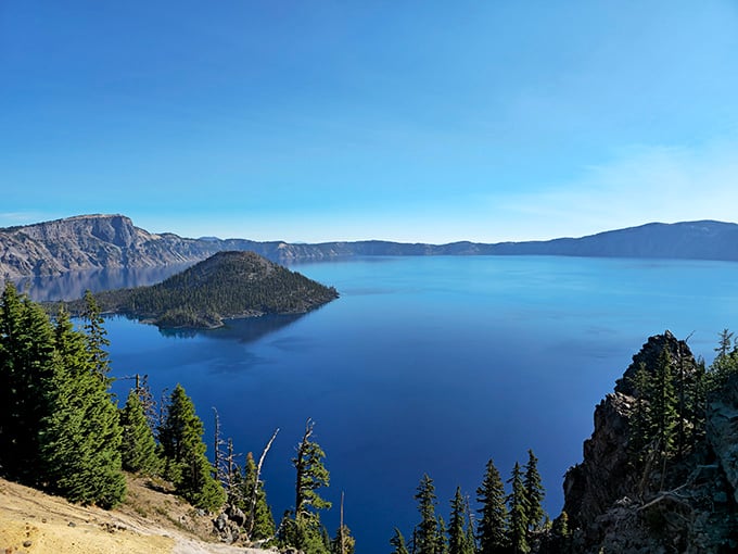 The stillness of this ancient caldera creates reflections so perfect you'll forget which way is up.