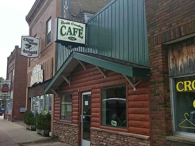 The North Country Cafe's log cabin facade promises hearty meals and conversations that linger over coffee.