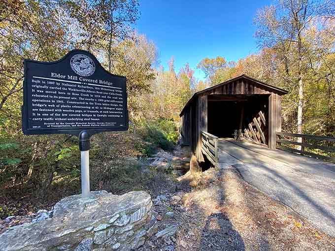 That historical marker stands guard like a proud grandfather, ready to share tales of the bridge's glory days with anyone.