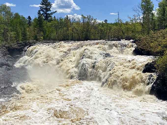 Full throttle and foaming white, Kawishiwi Falls roars through the pines like nature forgot to use its inside voice.