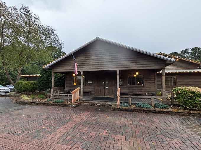 String lights framing a log cabin entrance on a cloudy Lake Norman afternoon? Yes, this is exactly where you belong tonight.