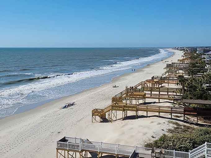 Wooden walkways march down the coastline like soldiers guarding this stretch of sand from overcrowding and chaos.