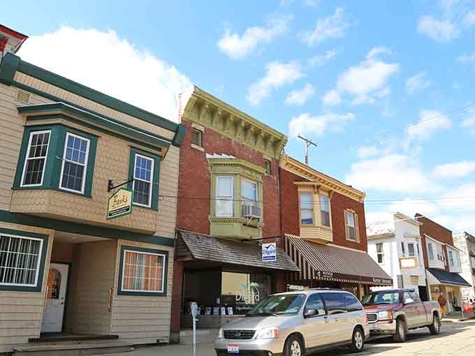 Loudonville's eclectic mix of storefronts lines up under a wide blue sky, each building telling a slightly different story in the same great neighborhood.