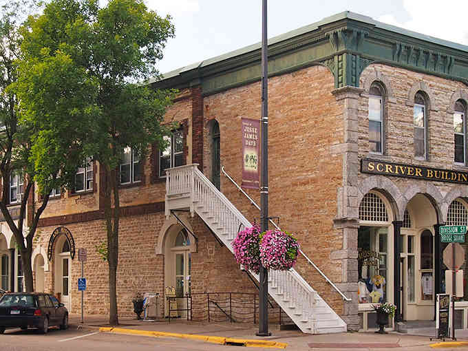 That distinctive stone staircase and arched windows belong to a building with stories etched into every brick.