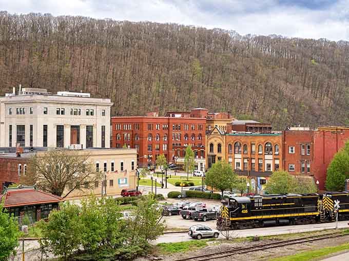 A locomotive rolls past Oil City's handsome brick buildings, reminding you that this town has always been going places.