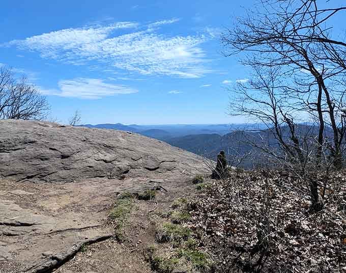 Clear skies reveal the full majesty of layered ridges stretching toward horizons that seem to go on forever.