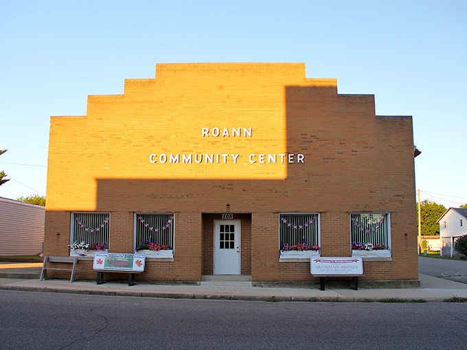 That cheerful yellow facade practically glows with community spirit, proving small-town gathering places still matter in our digital age.