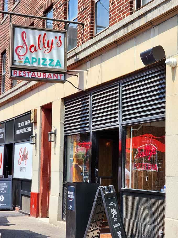 Warm afternoon light catches the Sally's storefront just right, making even the sidewalk look delicious from out here.
