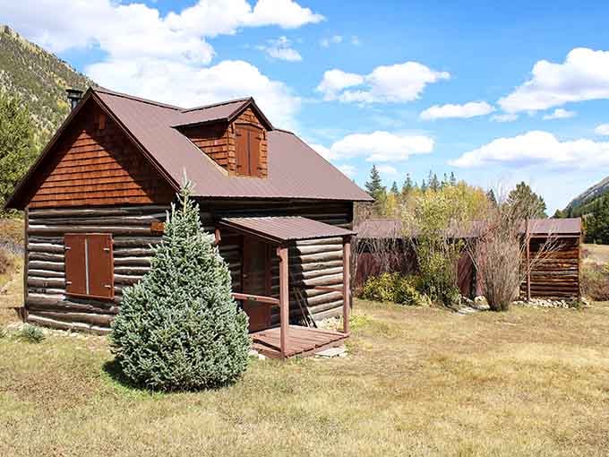 This two-story cabin with its cedar shake siding and covered porch looks like it's still waiting for someone to come home.