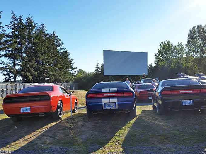 Muscle cars at a drive-in on a sunny afternoon. Somebody planned this perfectly, and we should all thank them.