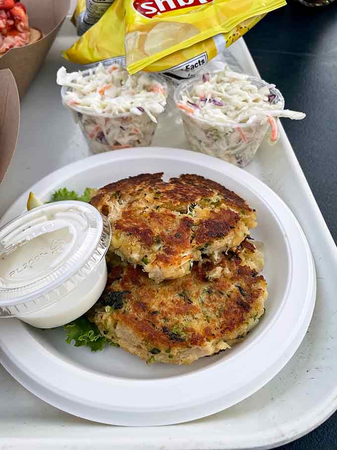 Golden, crispy crab cakes with a side of coleslaw, the kind of honest, no-nonsense cooking that makes you forget everything else exists.