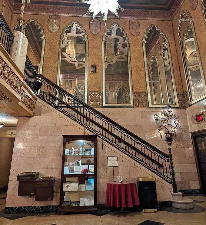 That grand staircase isn't just a way to reach the balcony, it's a full theatrical moment all by itself.