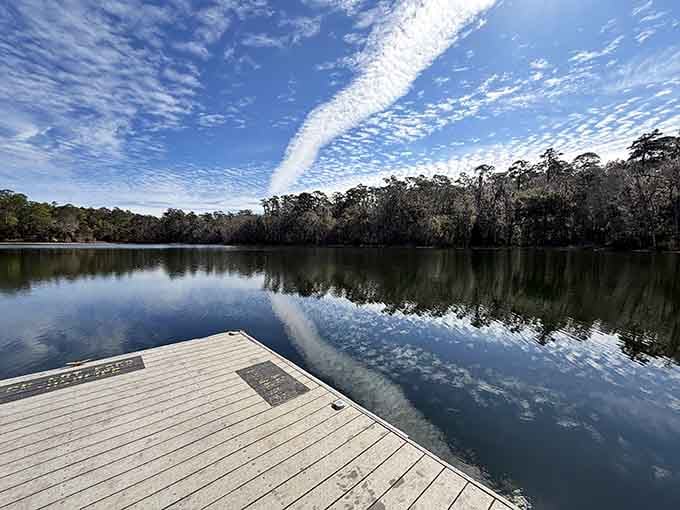 Lake Hall on a calm morning looks like the sky decided to lie down and take a nap.